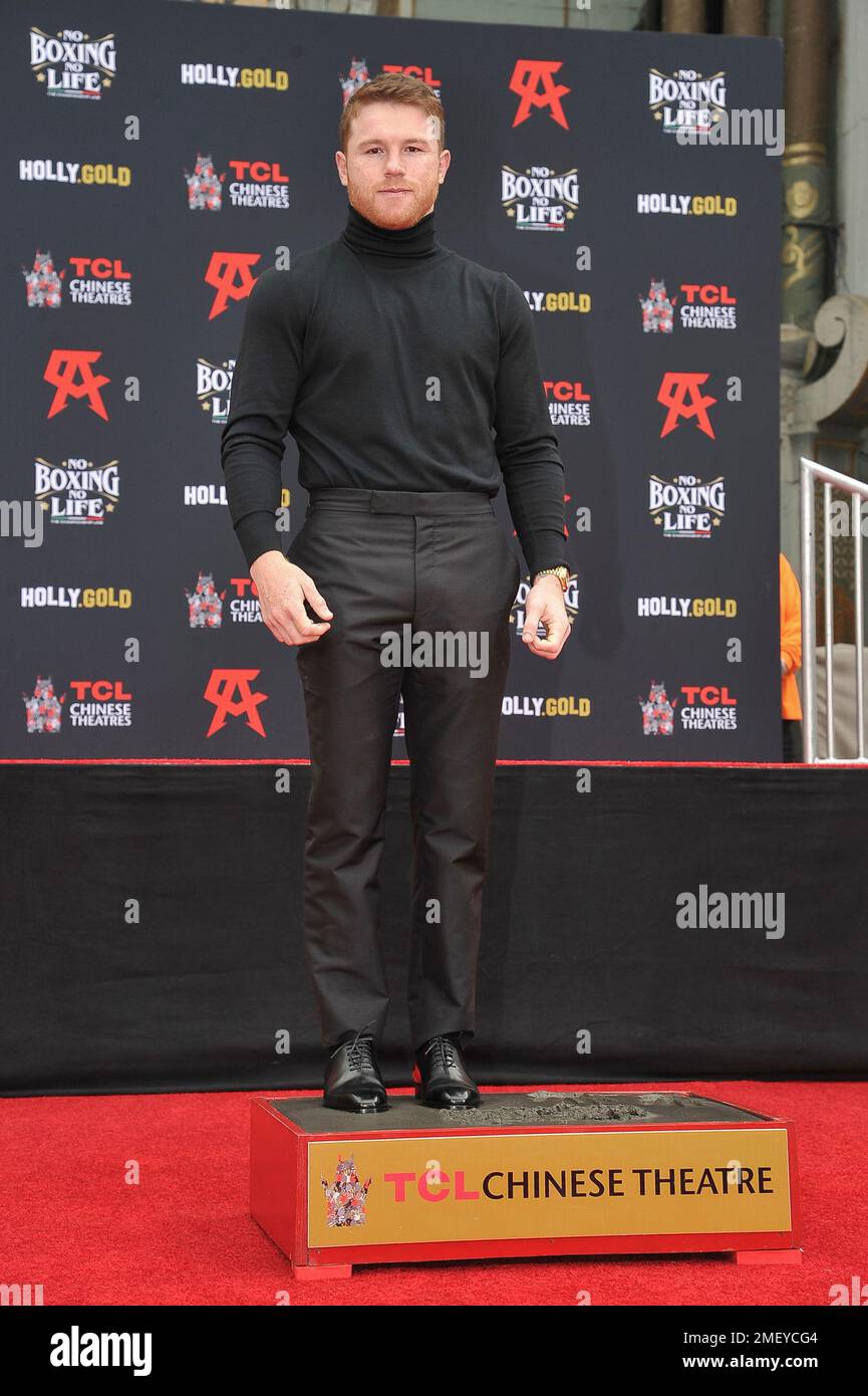 Boxer Canelo Alvarez placies his feet in cement during a ceremony in ...