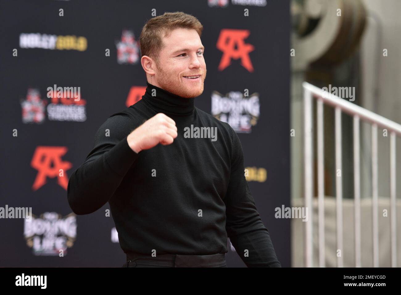 Boxer Canelo Alvarez poses for photos after placing his hands in cement ...