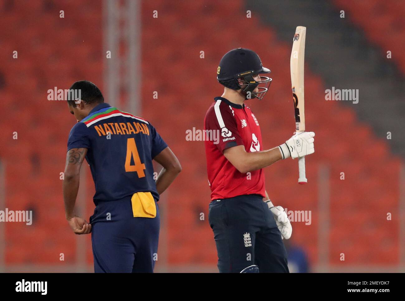 England's Dawid Malan, right, celebrates scoring fifty runs during the ...