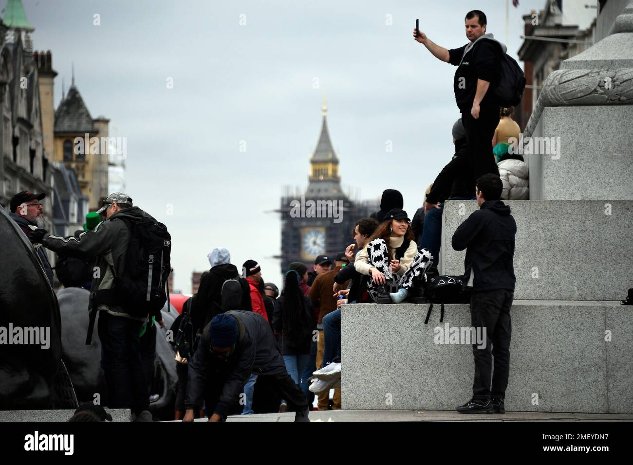 People without face masks attend a protest against government ...