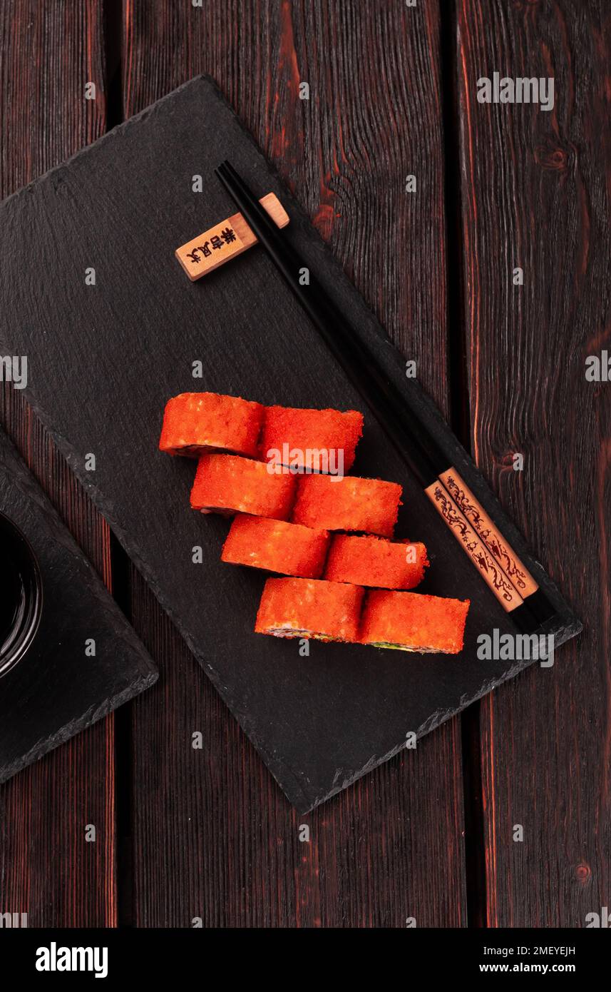 Roll with fish sushi with chopsticks top view - asian food concept ...