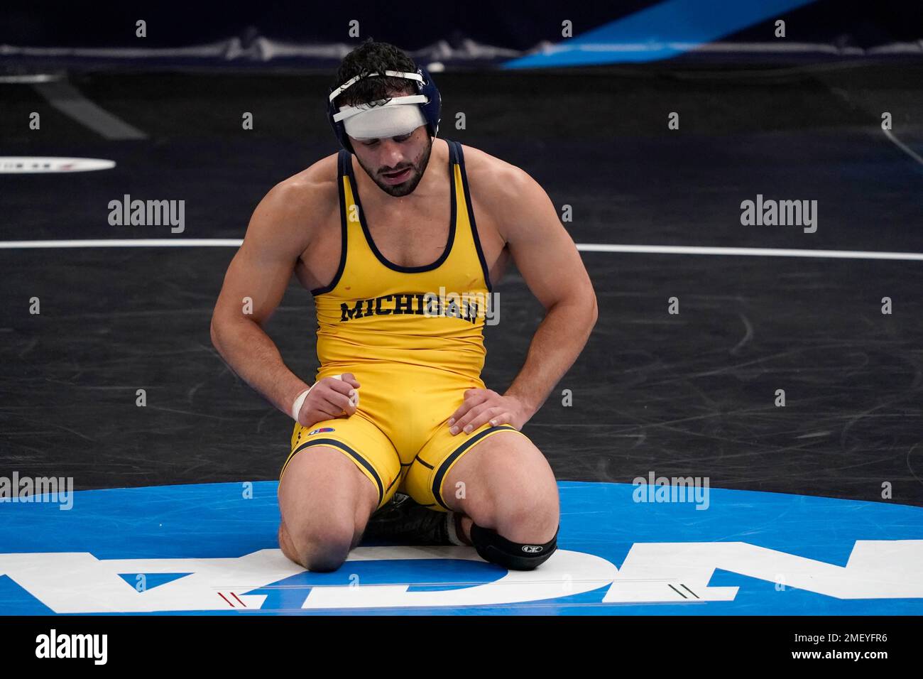 Michigan's Myles Amine pauses after losing to Oklahoma State's AJ ...