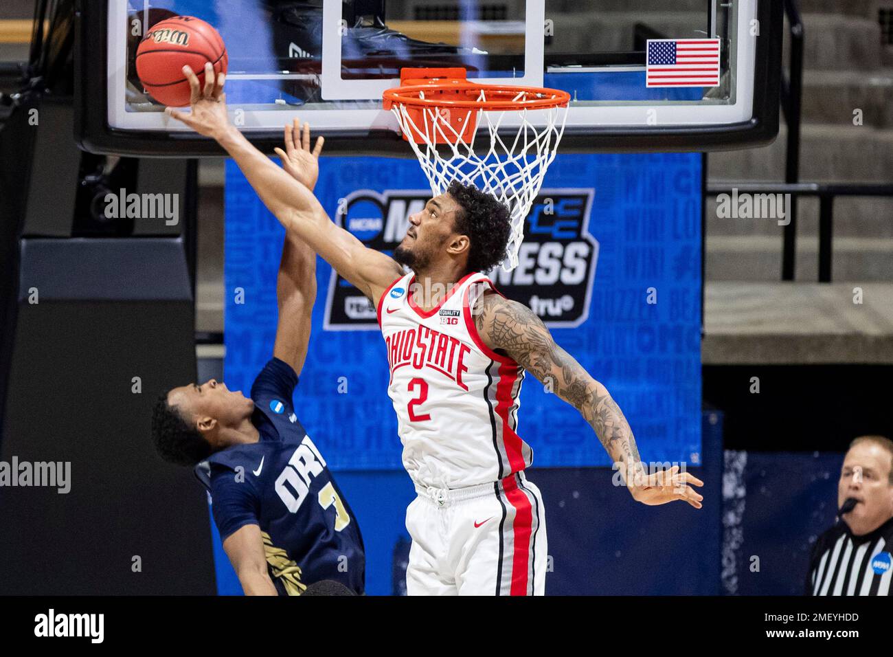 Ohio State's Musa Jallow (2) blocks a shot by Oral Roberts' Max Abmas (3) during the second half ...