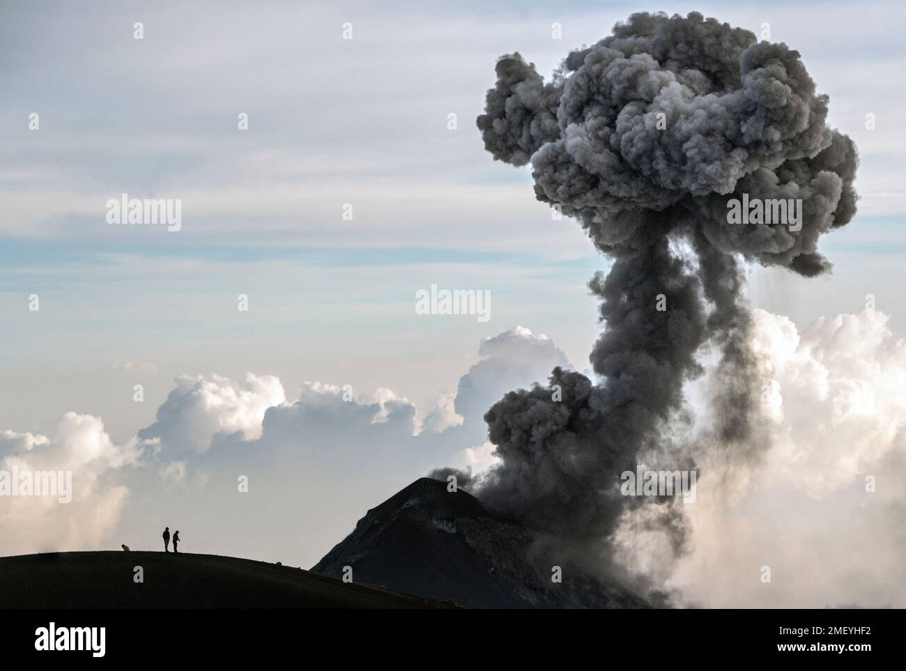Hikers view Fuego Volcano as it erupts, from atop the Acatenango summit ...