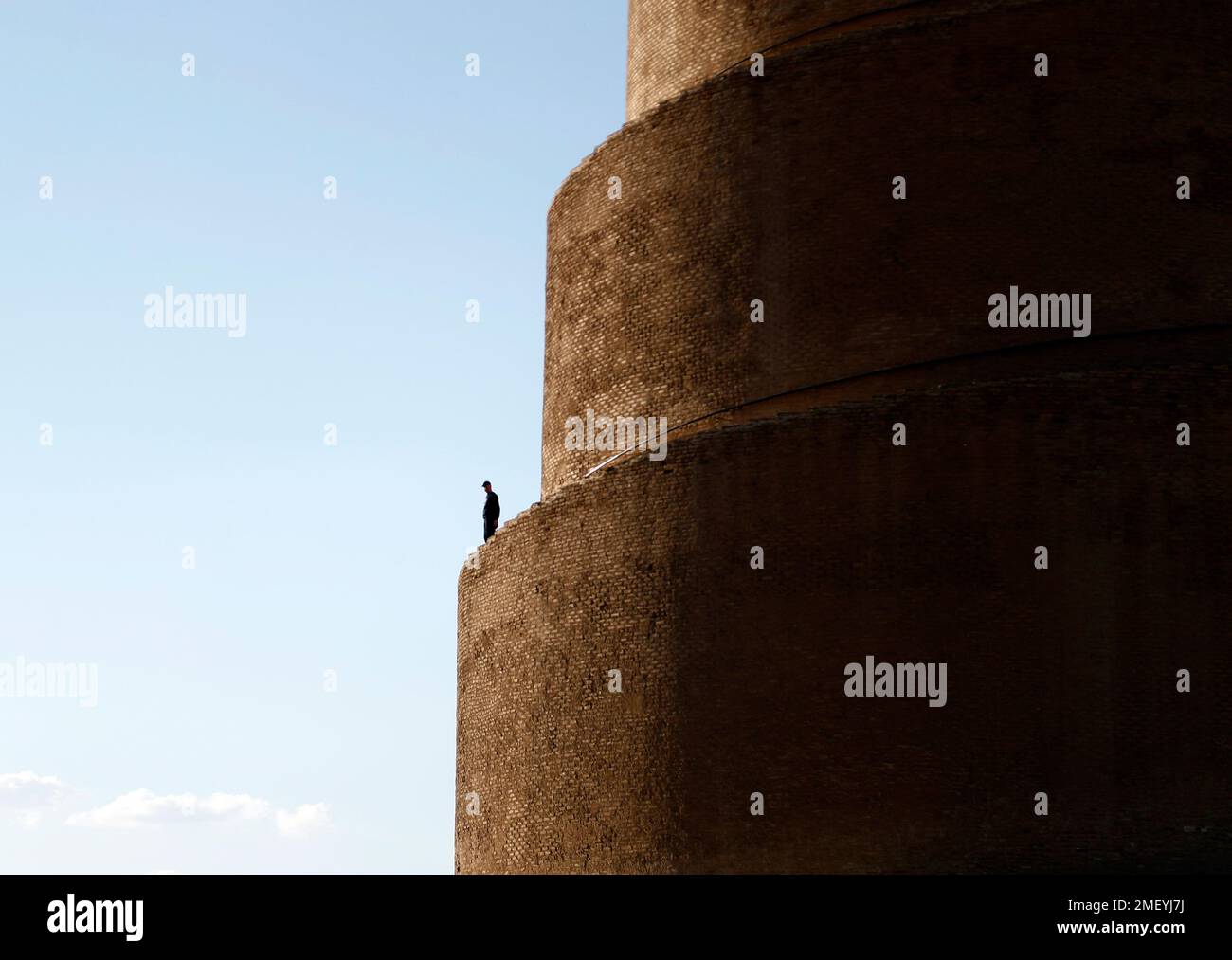 A man visits the al-Malwiya minaret at the Al-Mutawakkil Mosque in ...