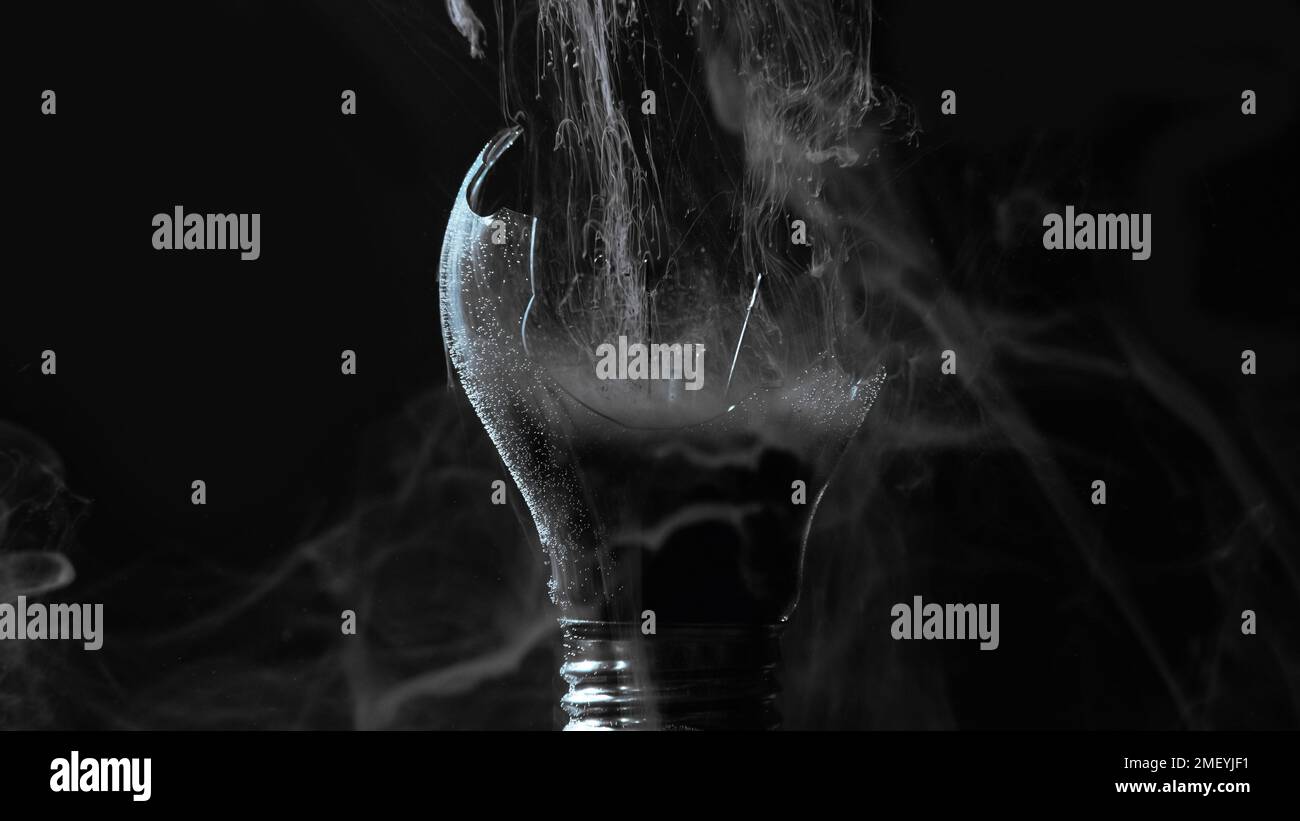 Lamp explosion smoke cloud gray broken light bulb Stock Photo - Alamy
