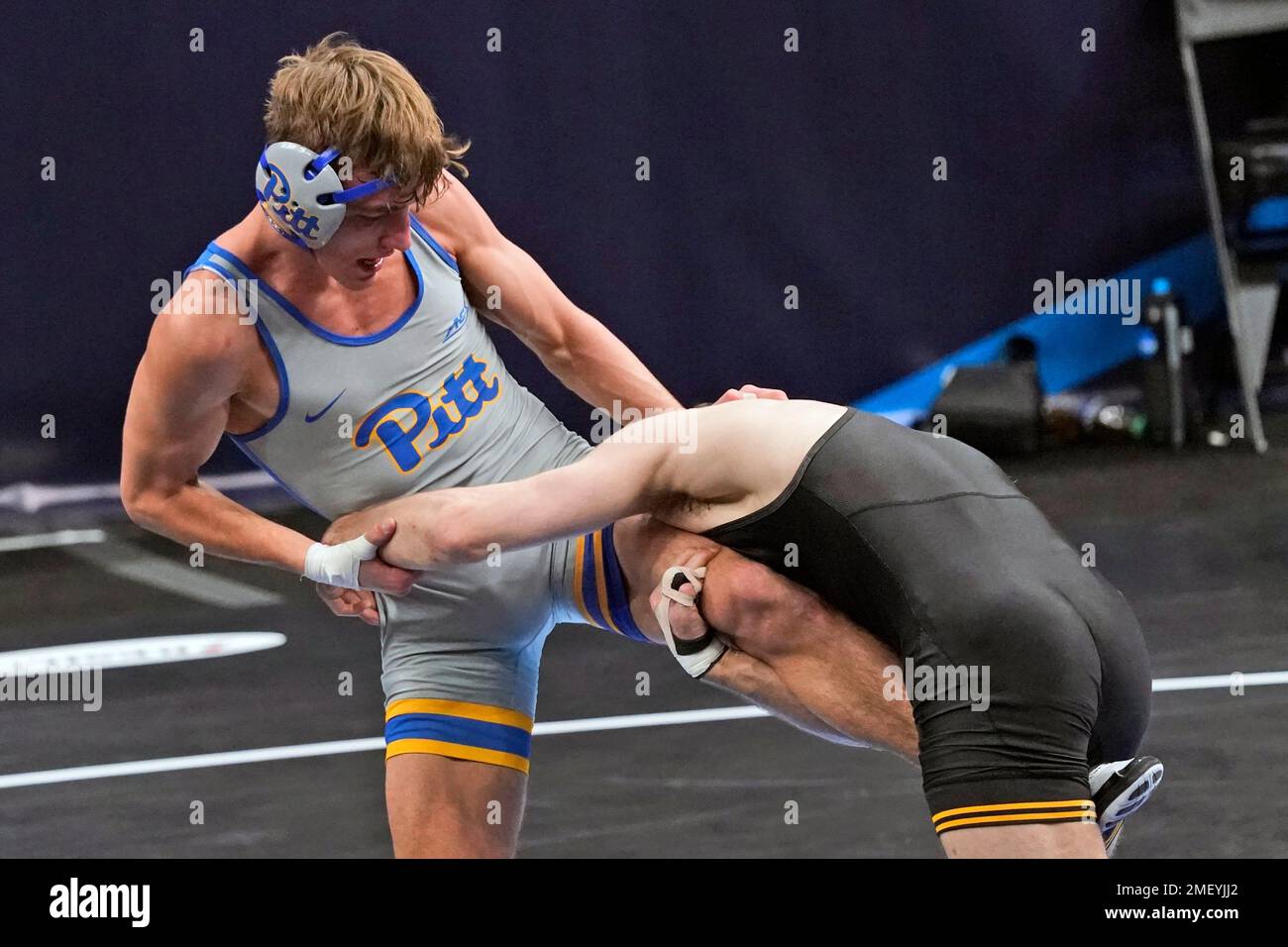 Pittsburgh's Micky Phillippi, left, takes on Iowa's Austin DeSanto ...