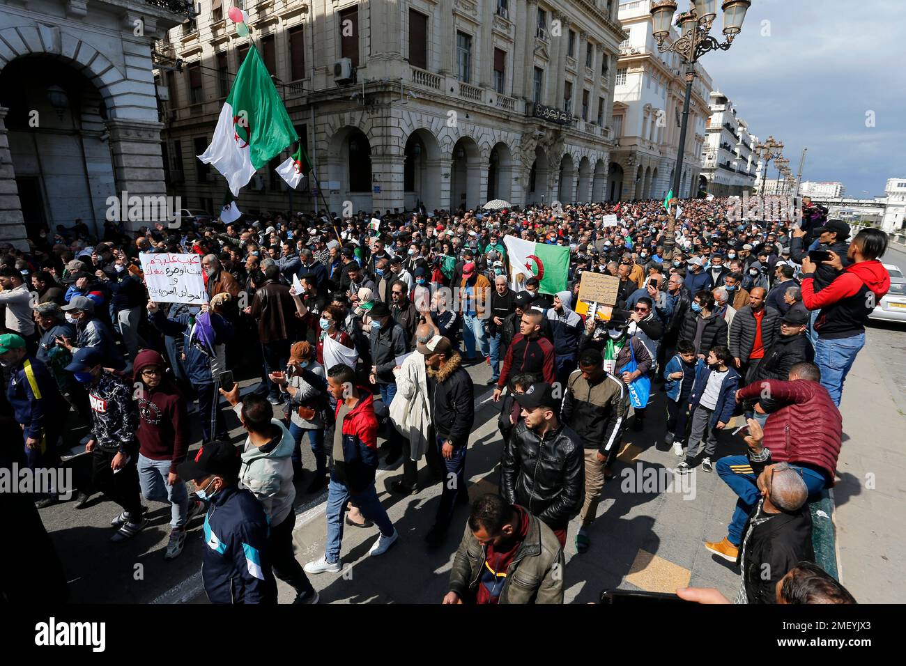 Algerians protesters march during their weekly pro-democracy ...