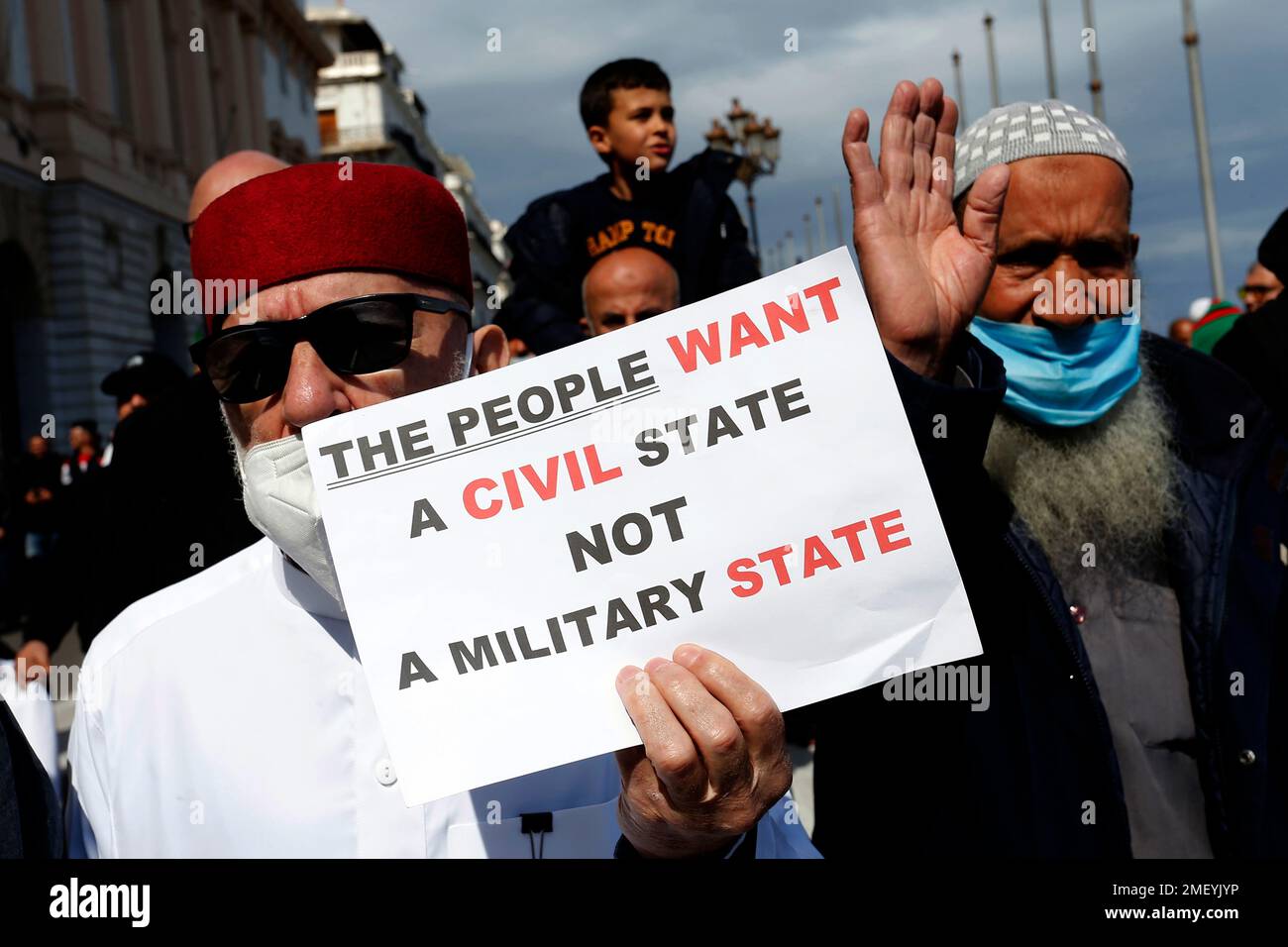 Algerians protesters march with posters during their weekly pro ...
