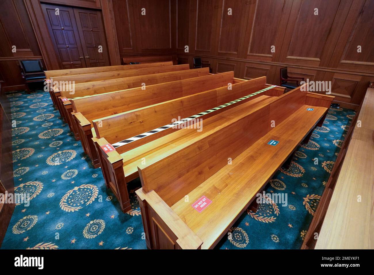 Stickers and tape marking proper social distancing block off entire ...