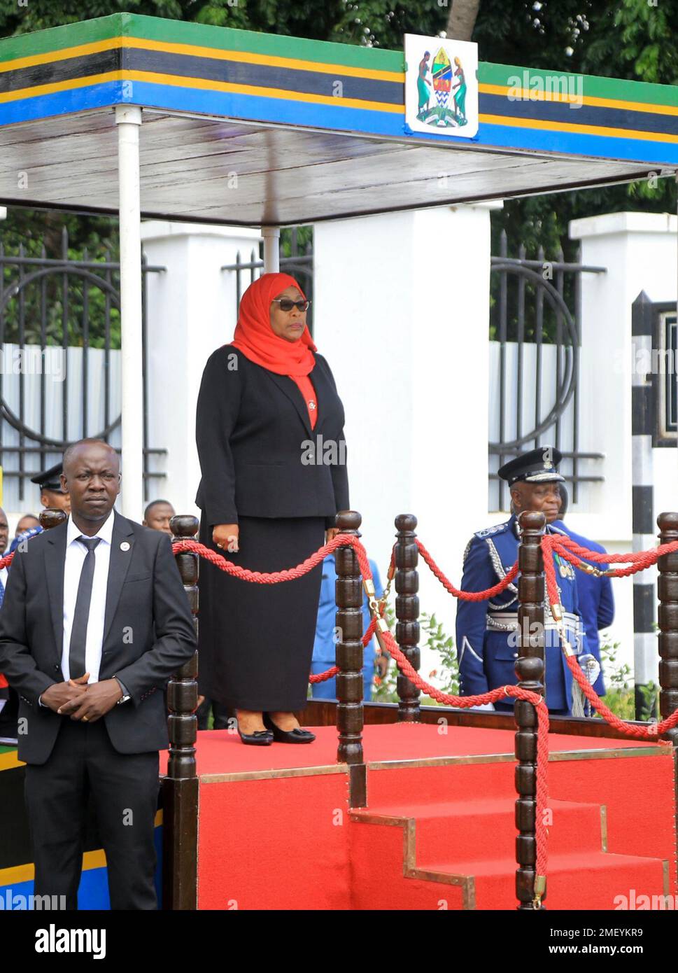 Tanzania's new president Samia Suluhu Hassan, center, is sworn in at a ceremony at State House ...