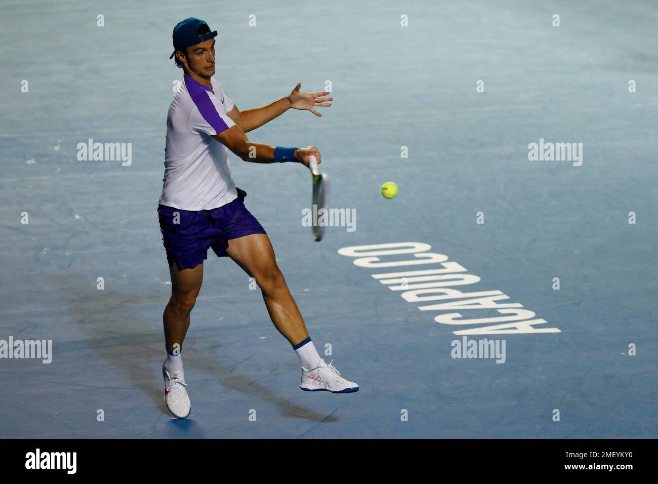 Italy's Lorenzo Musetti returns a ball during his quarterfinal match ...