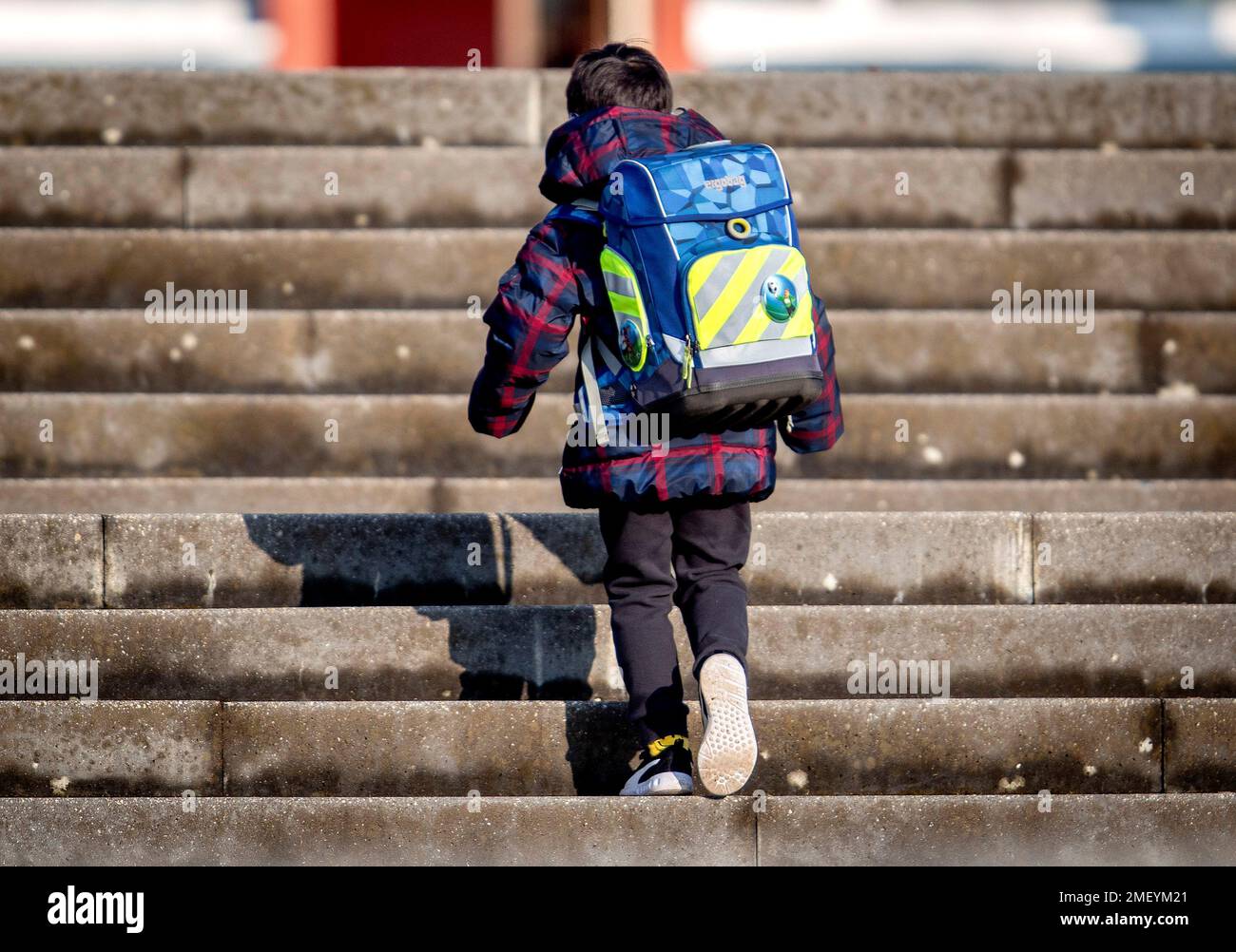 A boy goes to school in Frankfurt, Germany, Friday, March 19, 2021, as ...