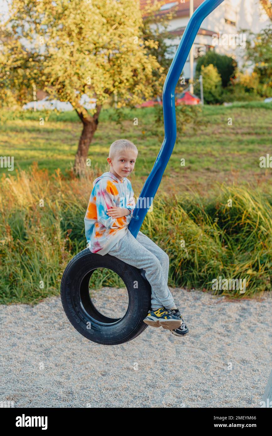 Funny cute happy baby playing on the playground. The emotion of ...