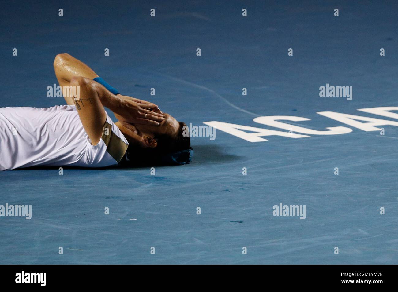 Italy's Lorenzo Musetti sprawls on the court as he celebrates winning ...