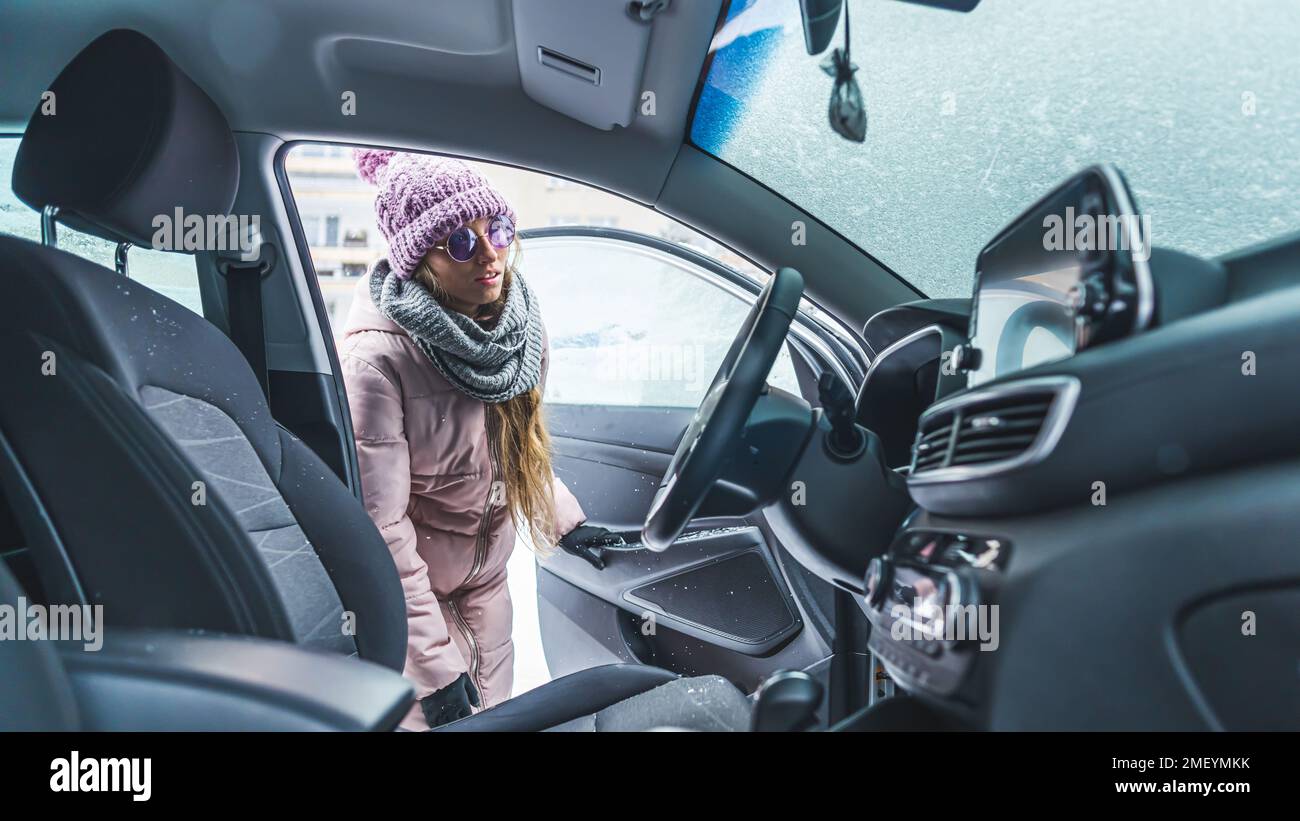 Woman peering through door hi-res stock photography and images - Alamy