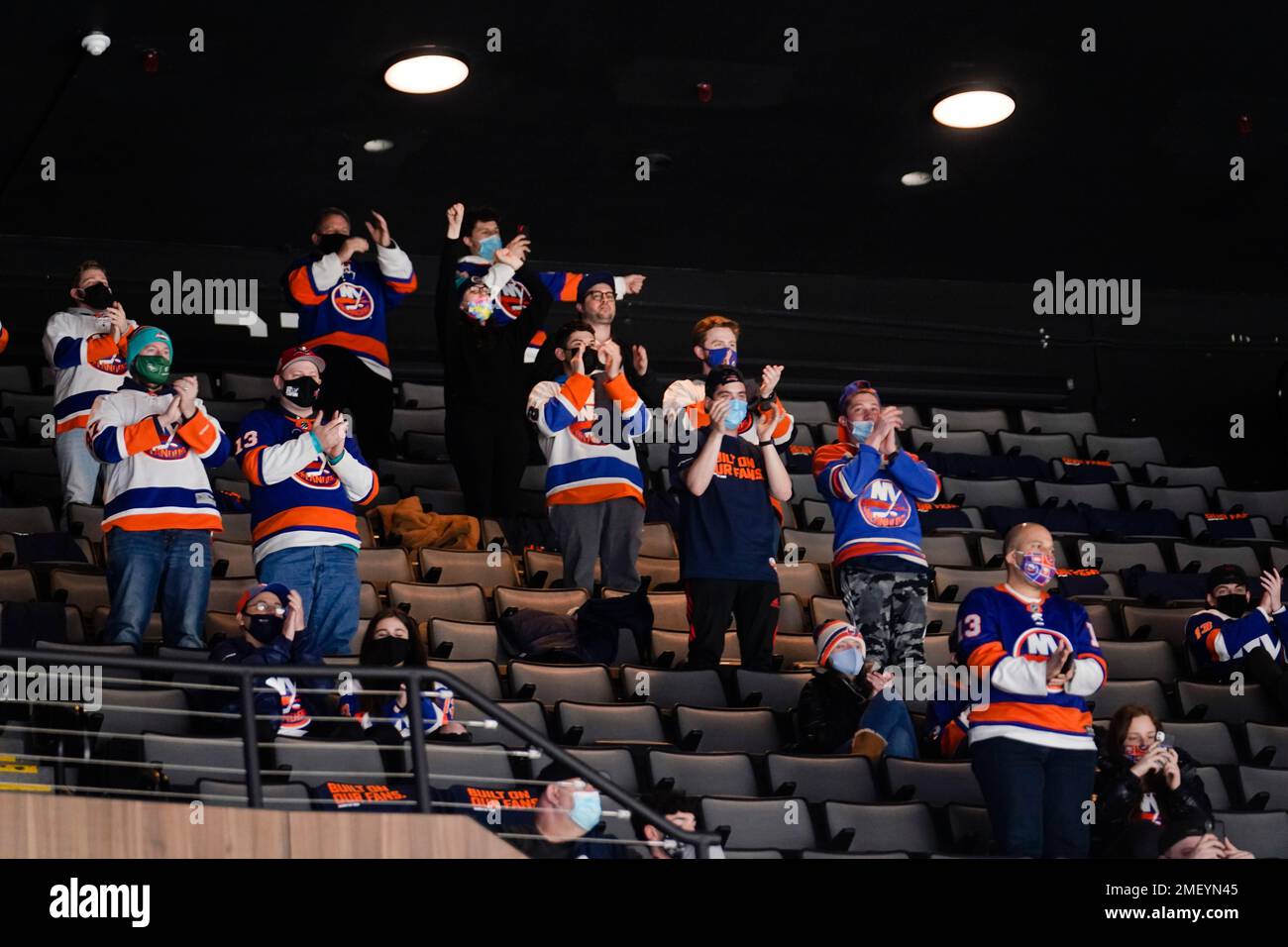 New York Islanders fans cheer beforean NHL hockey game against the ...