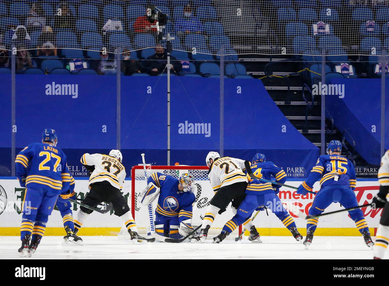 Buffalo Sabres goalie Carter Hutton (40) stops Boston Bruins Nick ...