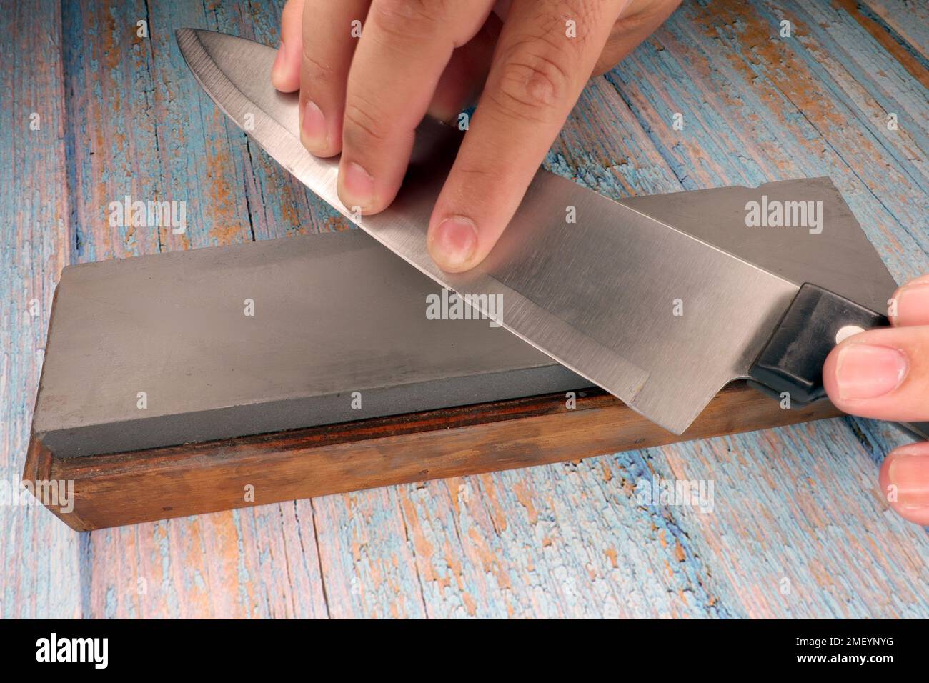 Sharpening knife grindstone hi-res stock photography and images - Alamy