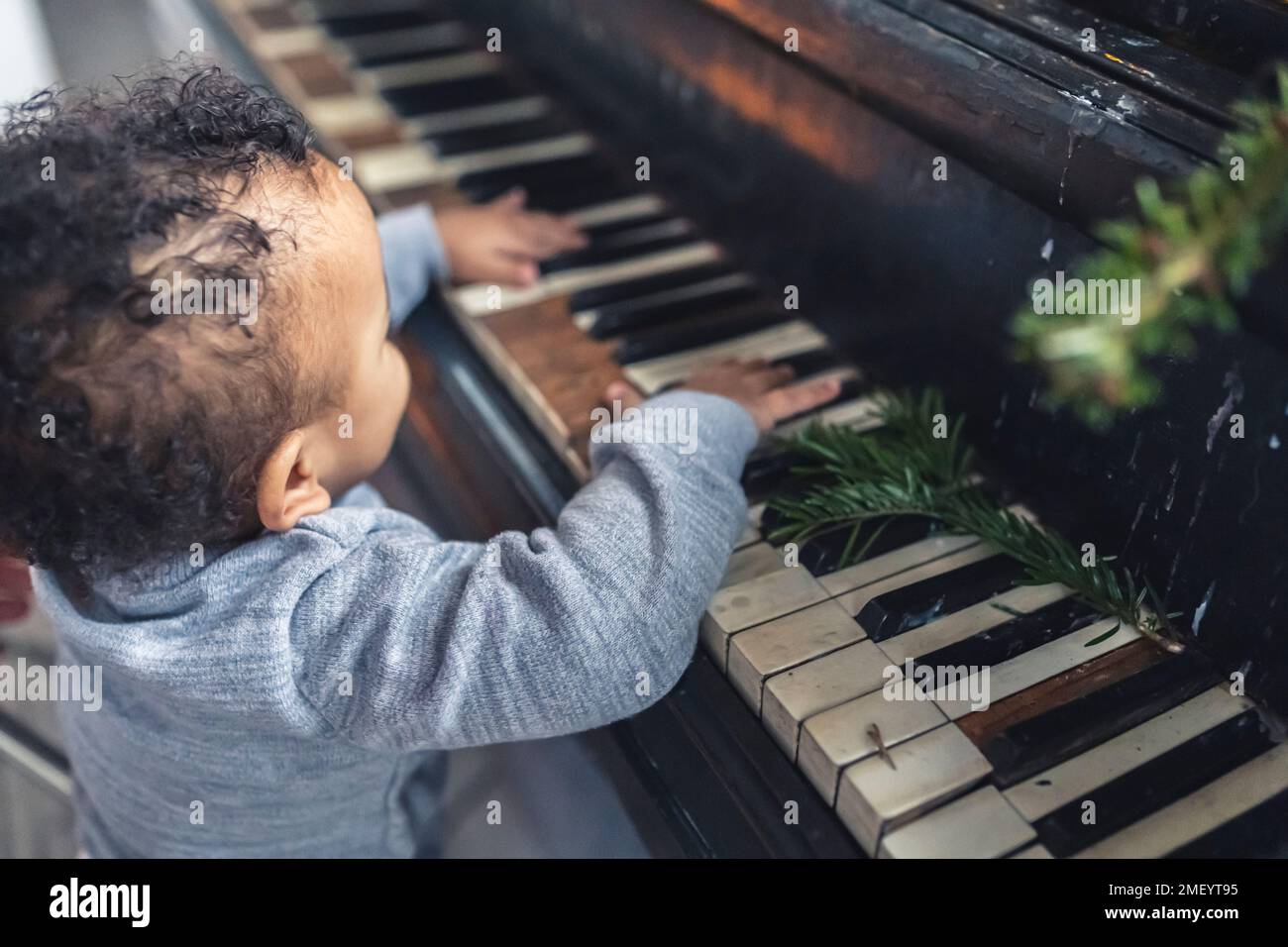 African American toddler boy playing the piano . High quality photo ...