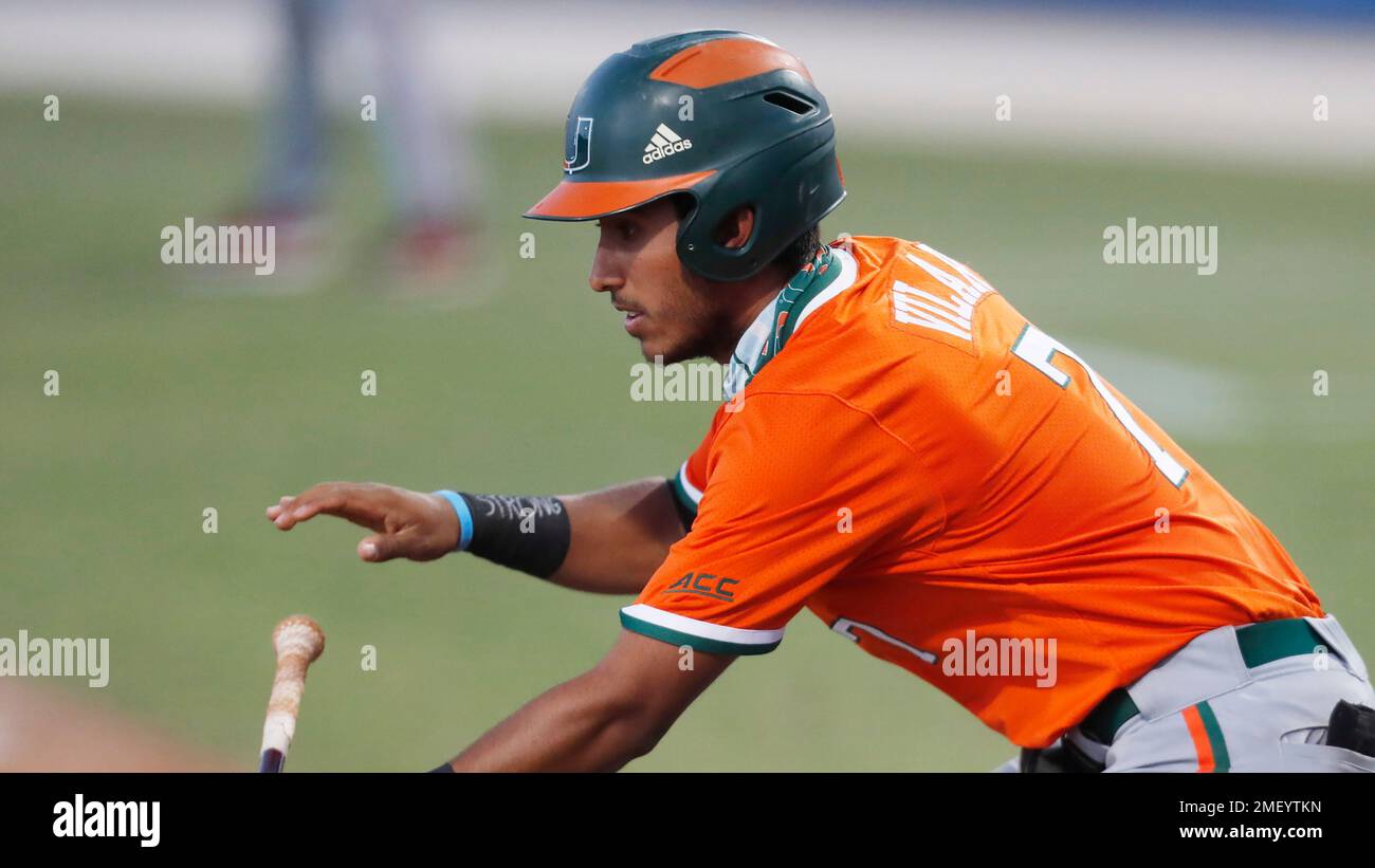 Miami Hurricanes infielder Anthony Vilar (7) attempts to bunt the ball ...