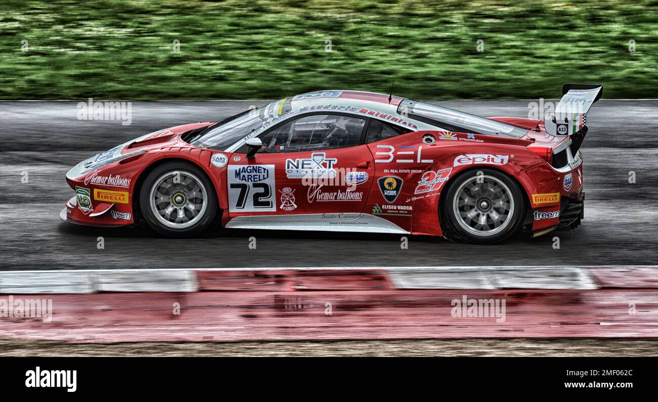 A Ferrari Misano Circuit car with rain panning Stock Photo - Alamy