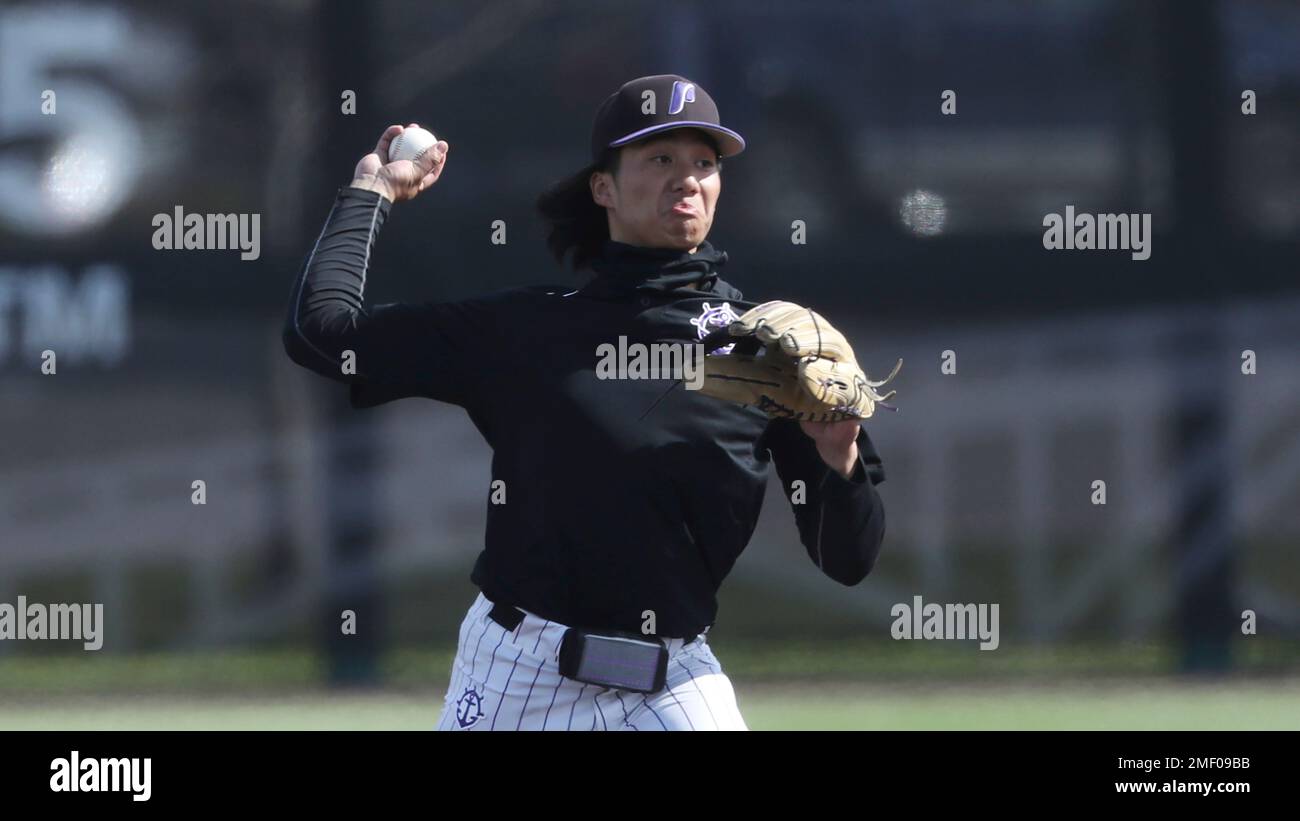Portland's Ben Patacsil throws to first during an NCAA baseball game ...