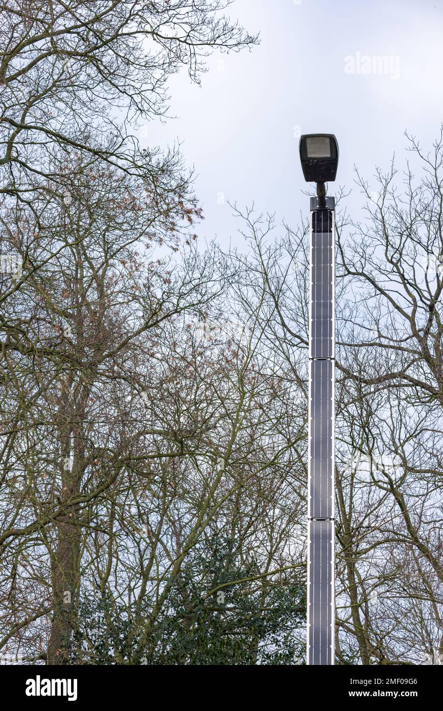 Modern self-sufficient public solar lights along the road at ...
