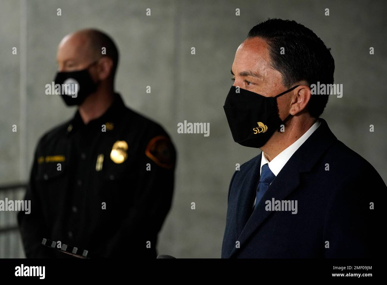 San Diego Mayor Todd Gloria, right, speaks in front of Fire Chief Colin ...
