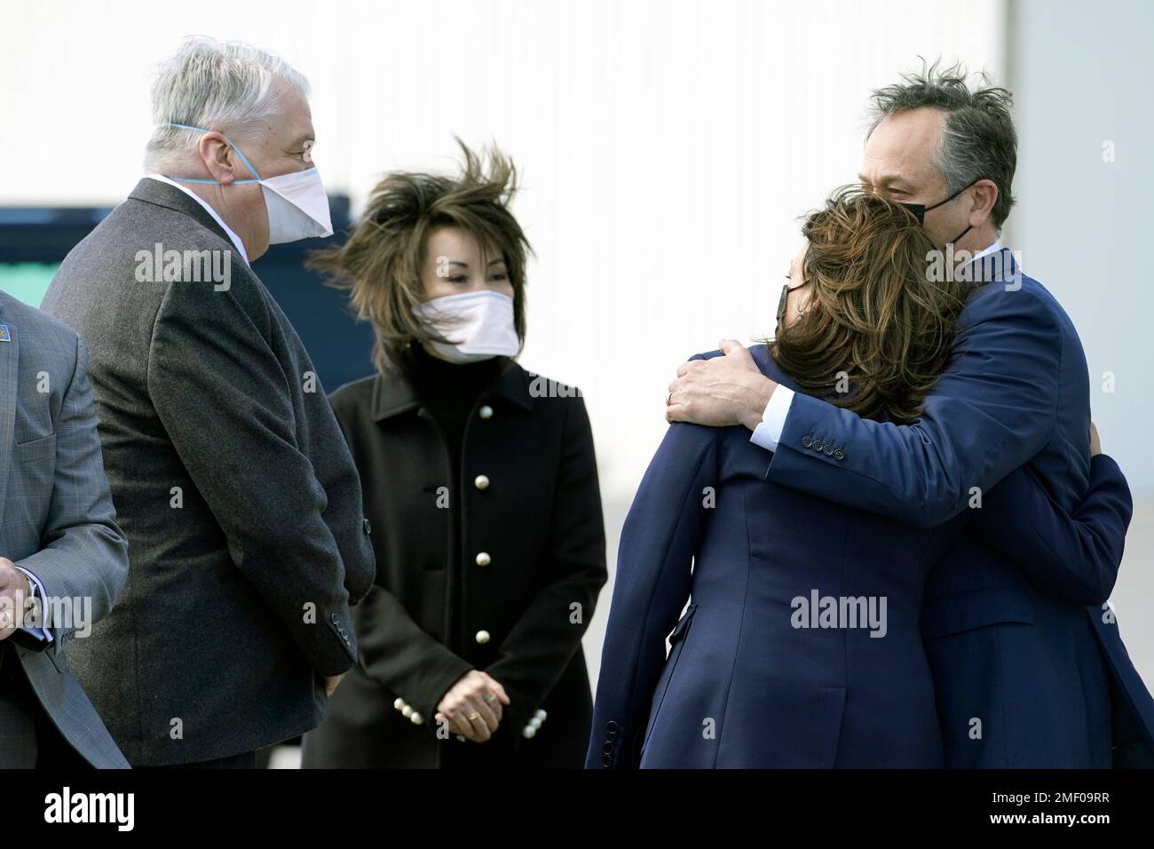 Vice President Kamala Harris and her husband, Doug Emhoff, are greeted ...