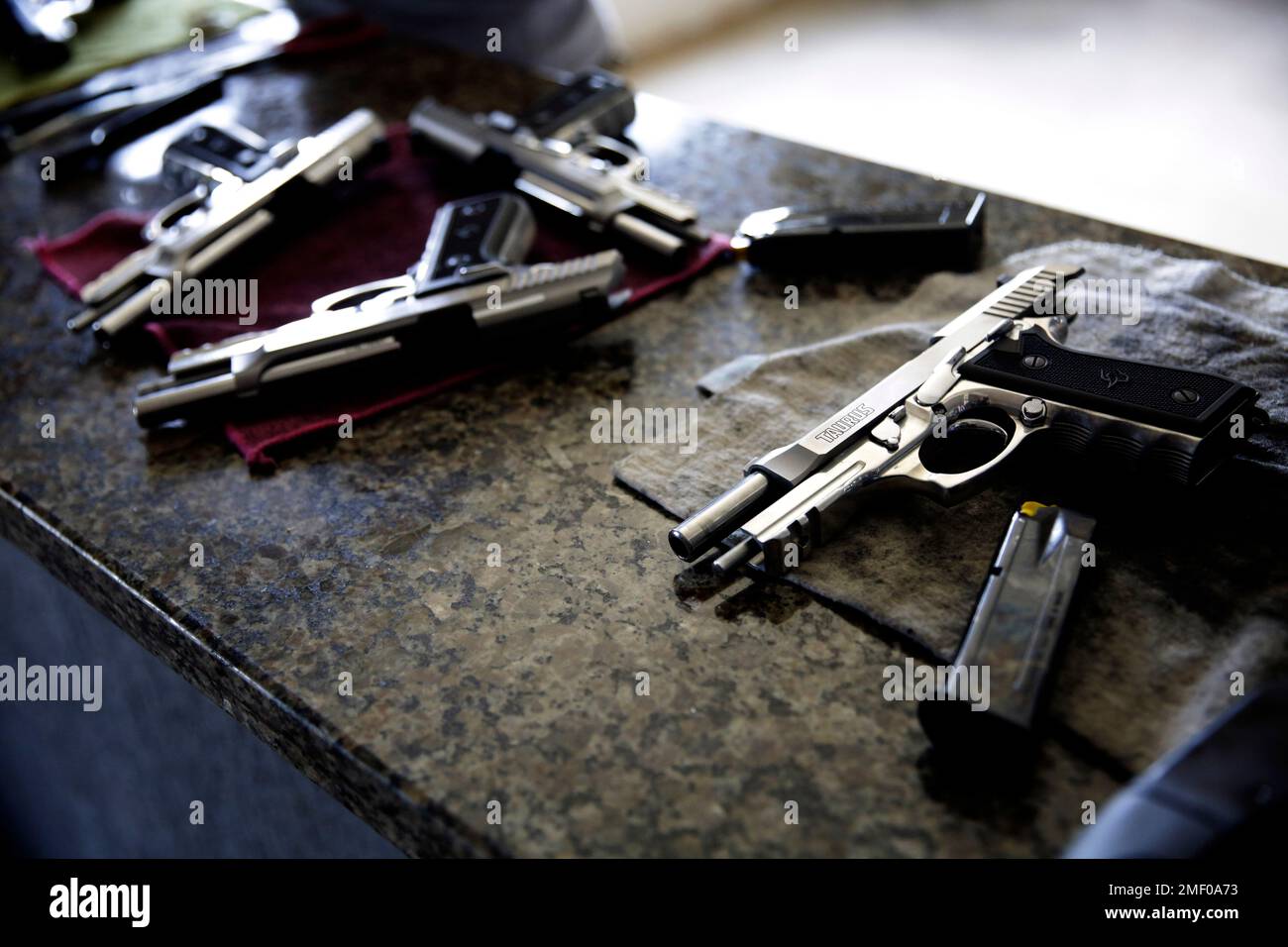 Hand guns sit on a counter at the Valparaiso Shooting Club, on the ...