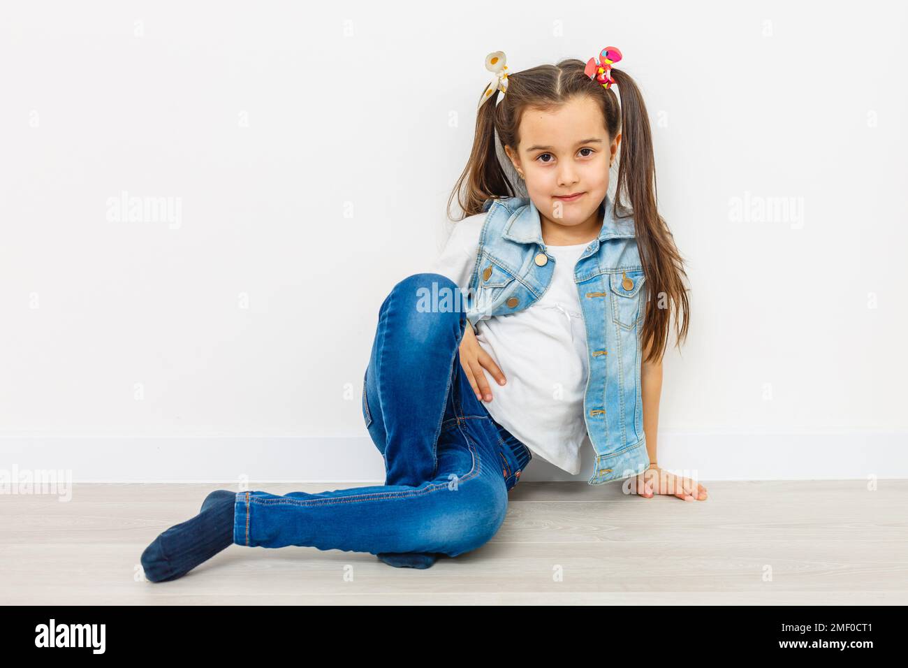 Shy little girl posing - isolated over a white background Stock Photo ...