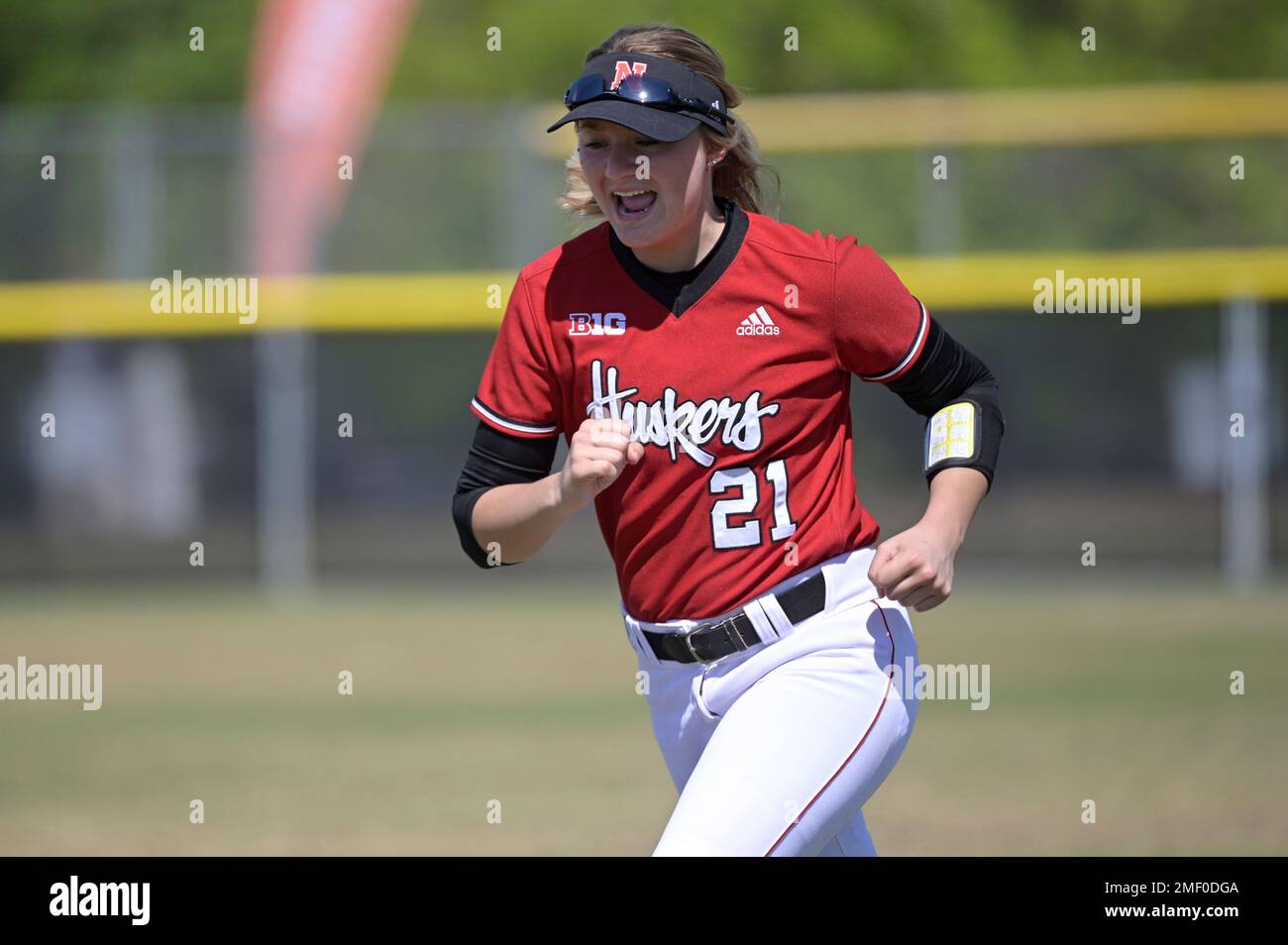 Nebraska's Sarah Yocom (21) runs before an NCAA college softball game ...