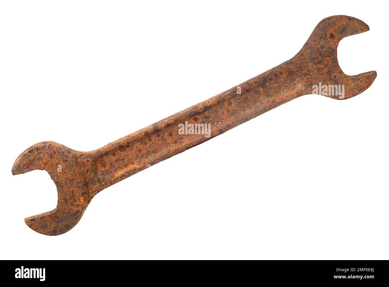 A rusting through metal spanner on white Stock Photo - Alamy