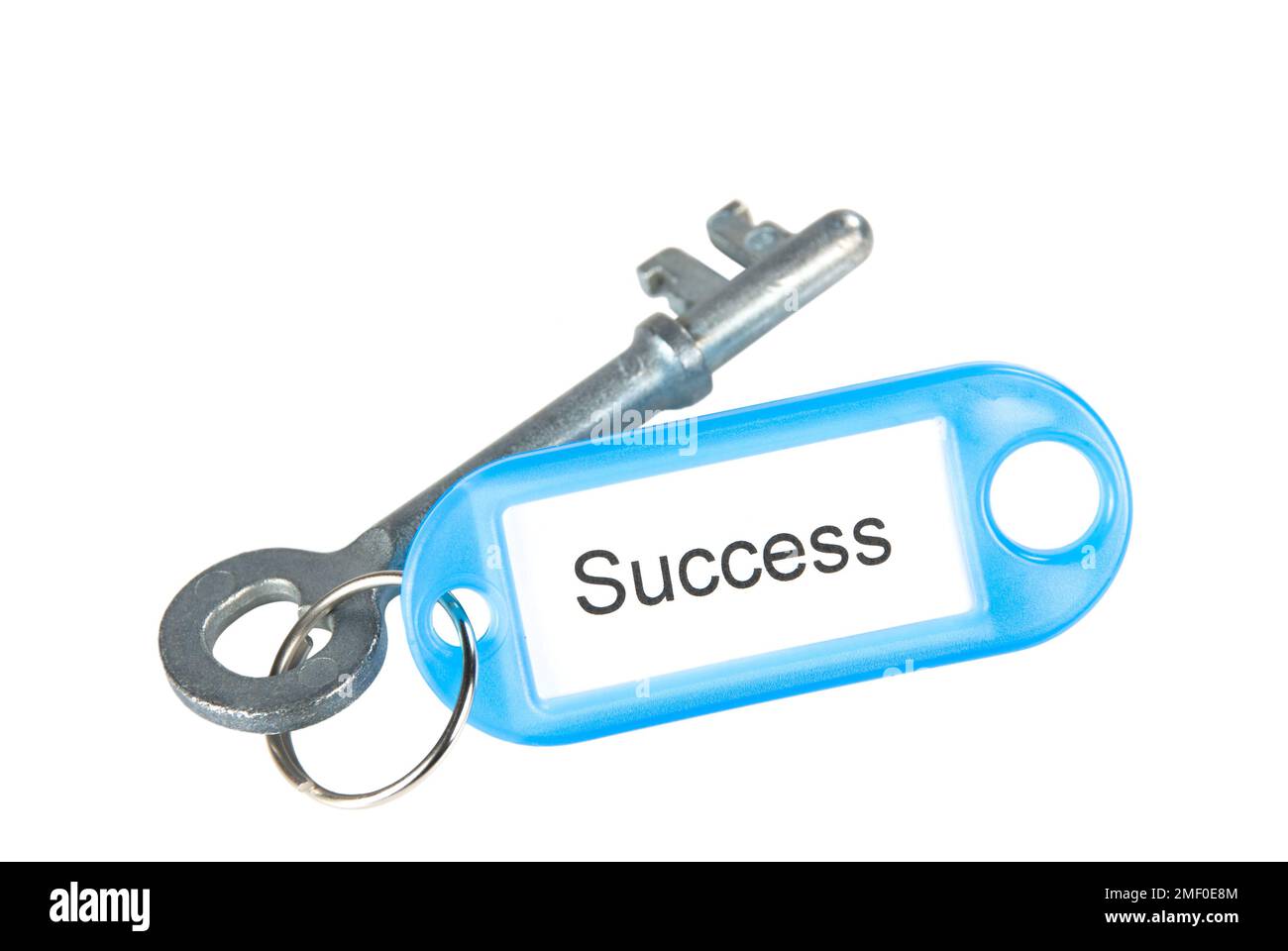 A key with a success label isolated on white Stock Photo - Alamy