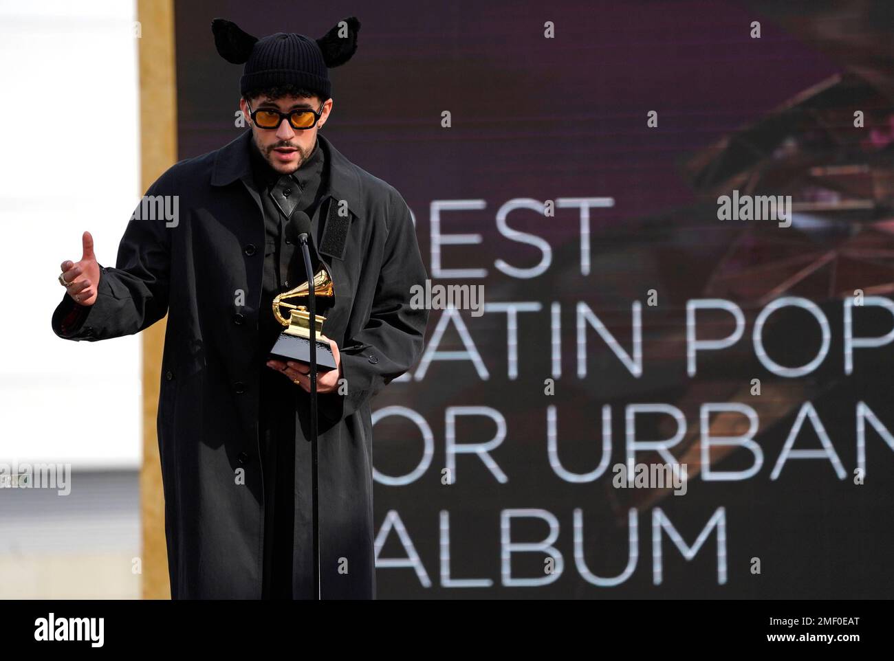 Bad Bunny accepts the award for best latin pop or urban album for ...