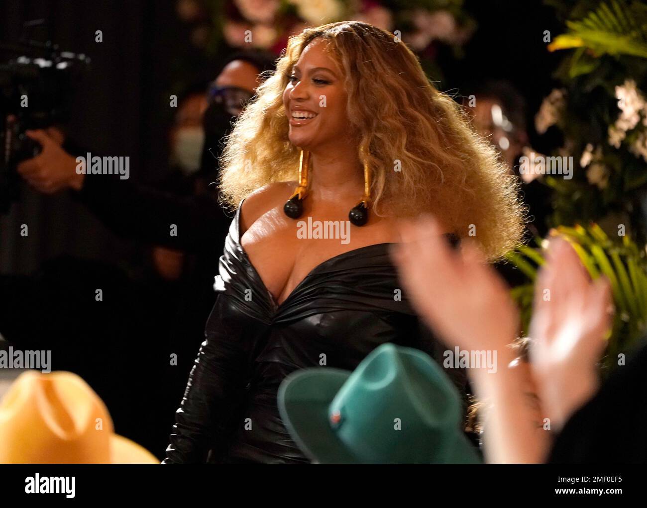 Beyonce appears in the audience before accepting the award for best rap ...