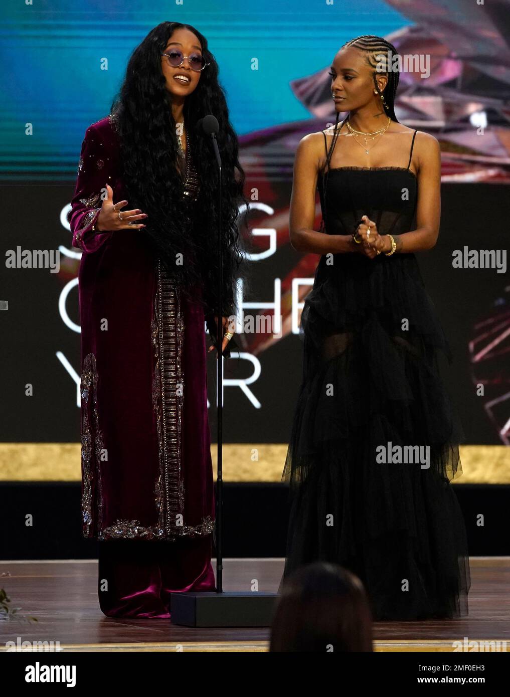 H.E.R., left, and Tiara Thomas accept the award for song of the year ...