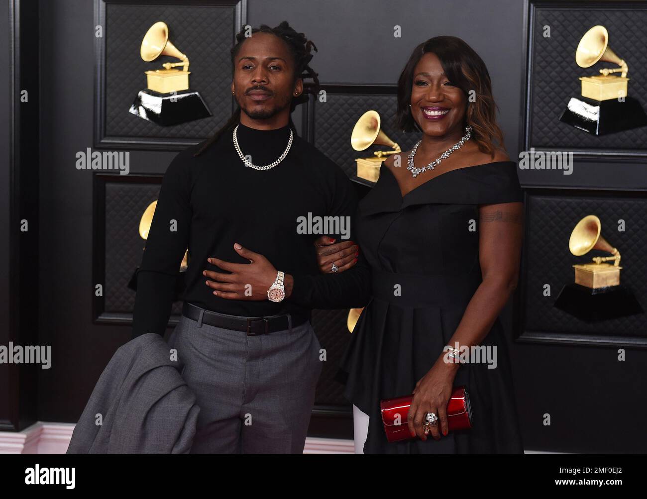 D Smoke, left, and Jackie Gouche-Farris pose in the press room at the ...