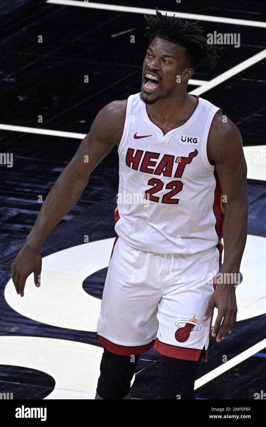 Miami Heat forward Jimmy Butler (22) celebrates after dunking the ball ...