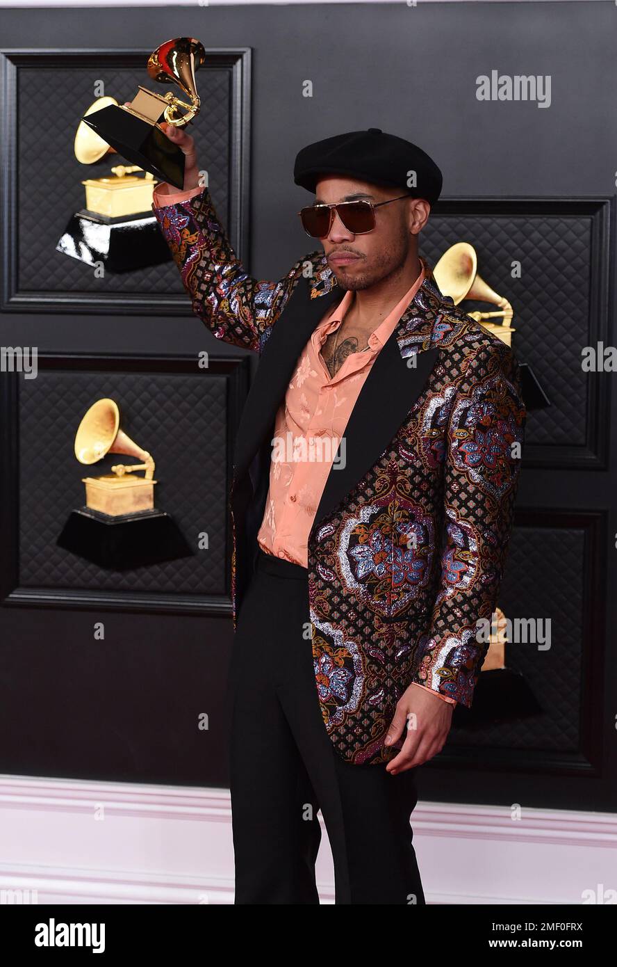 Anderson .Paak poses in the press room with the award for best melodic ...