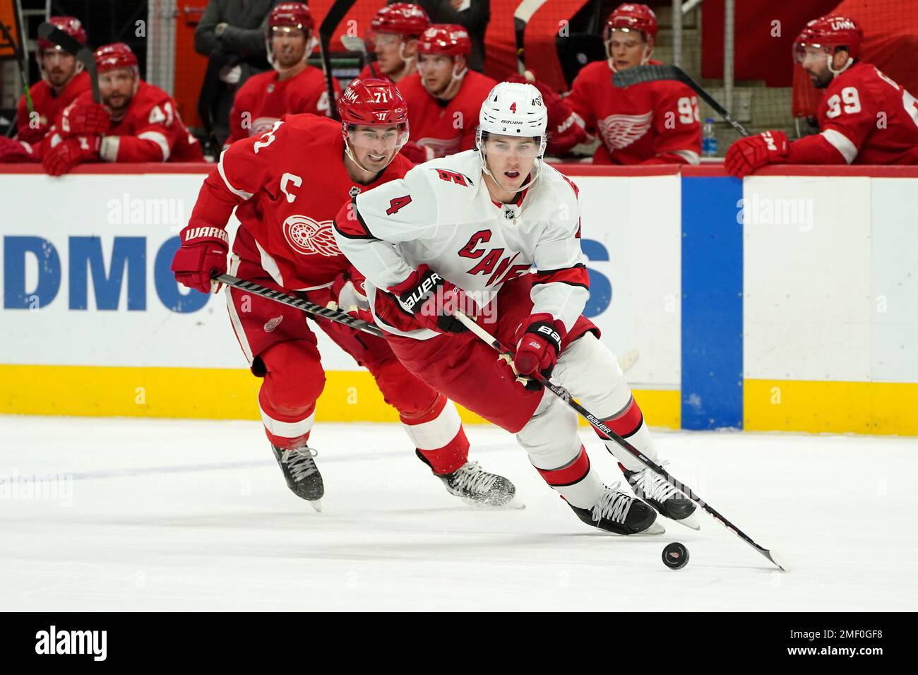 Carolina Hurricanes defenseman Haydn Fleury (4) protects the puck from ...