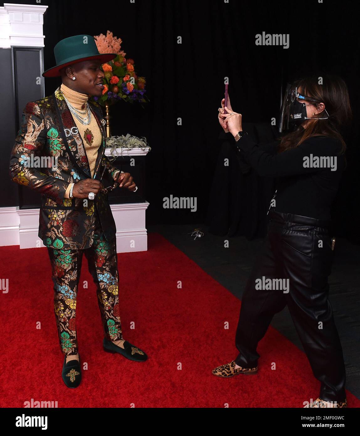 DaBaby poses for a photo as he arrives at the 63rd annual Grammy Awards ...
