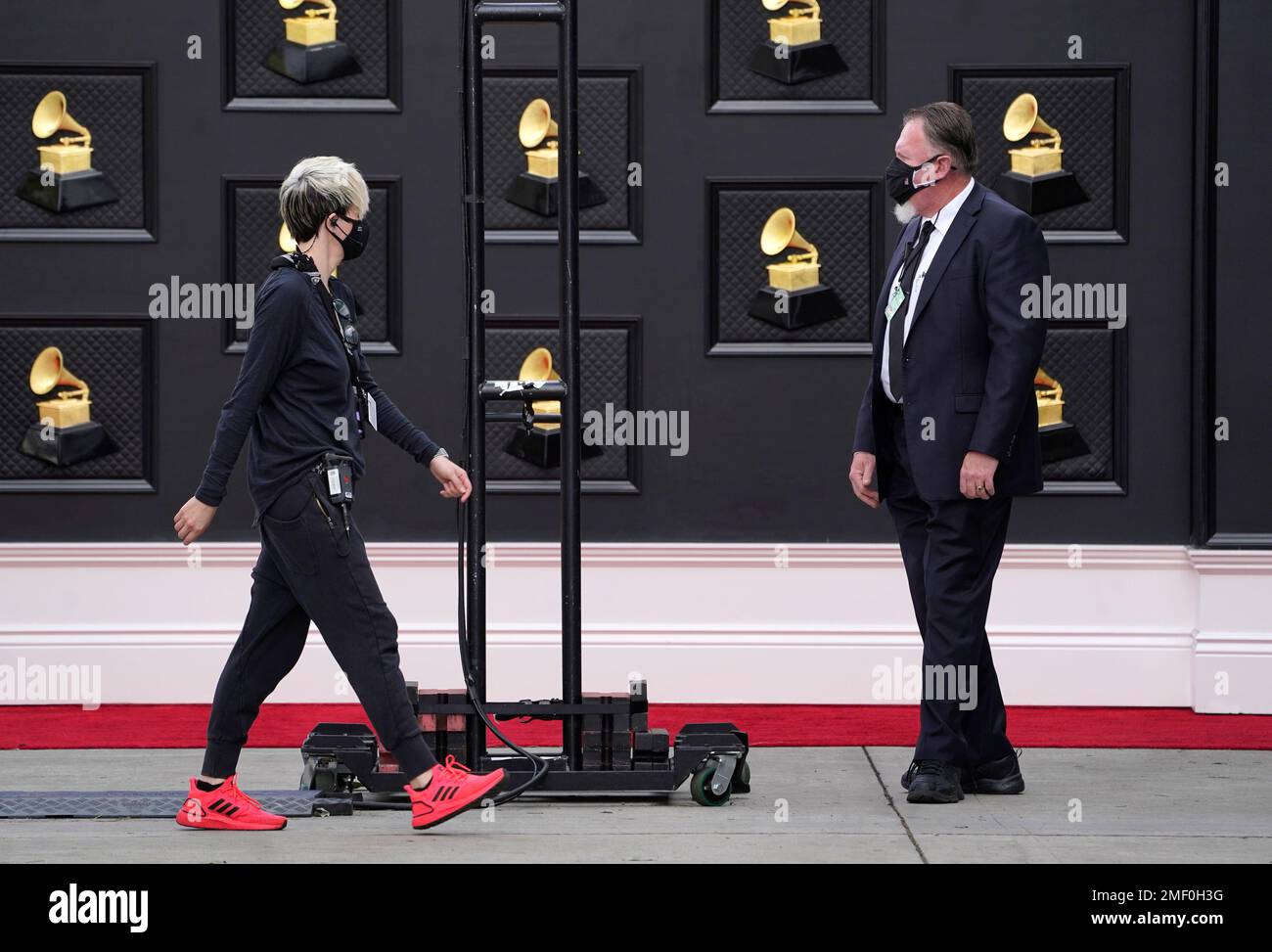 Staff members appear before the start of the 63rd annual Grammy Awards ...