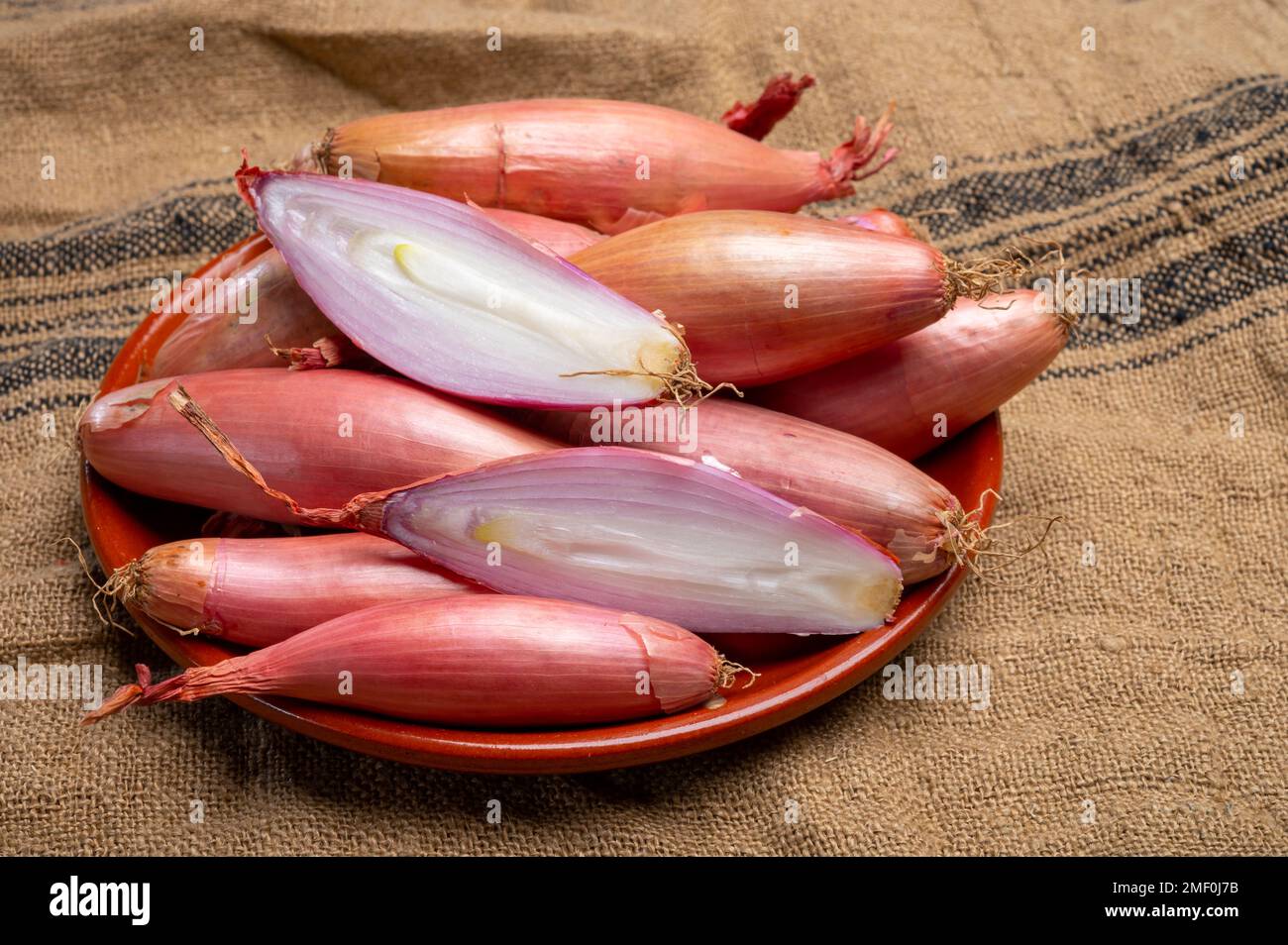 Onion collection, pink long French shallot onlons close up Stock Photo ...