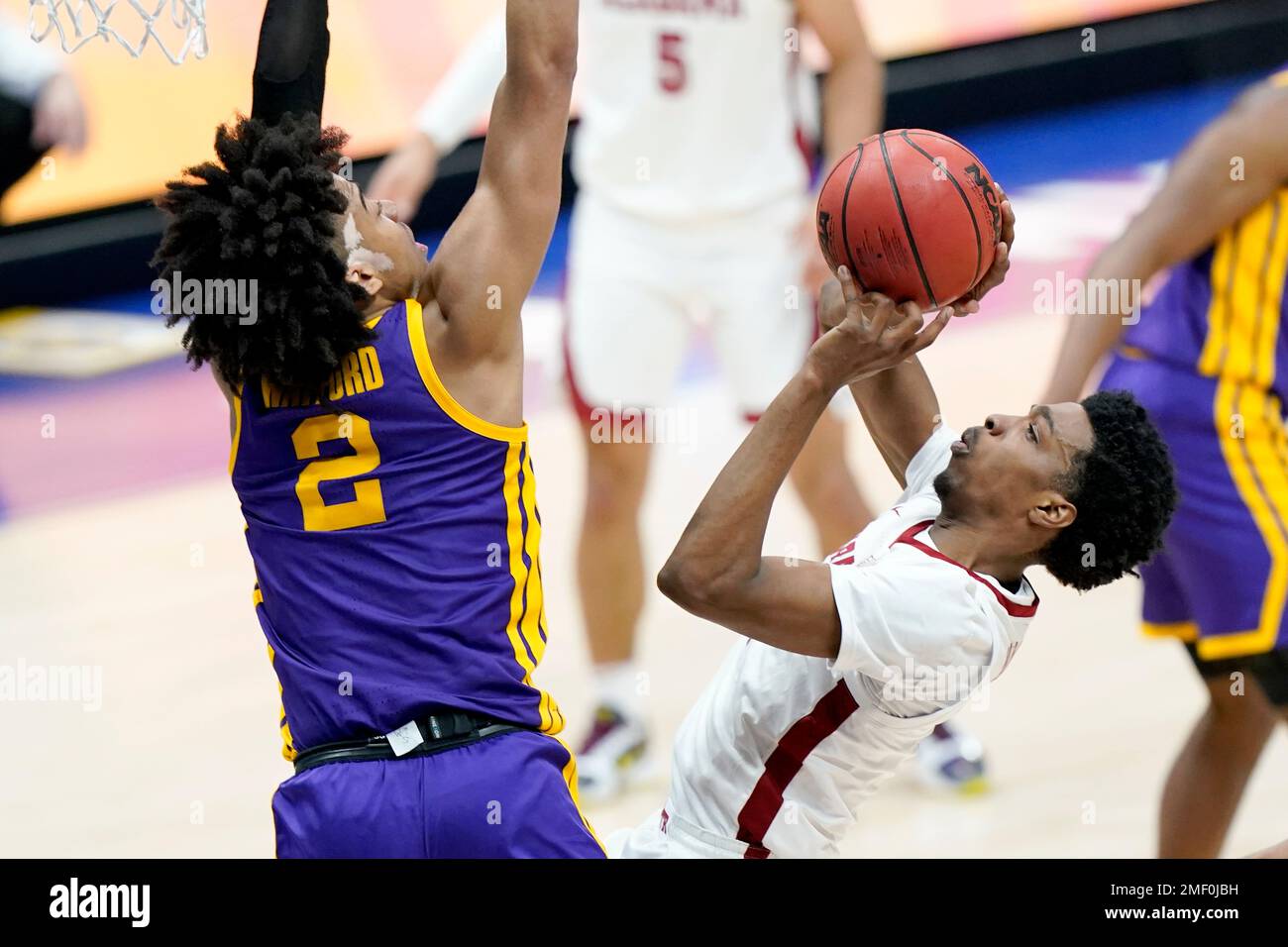 Alabama's Herbert Jones, right, shoots against LSU's Trendon Watford (2 ...