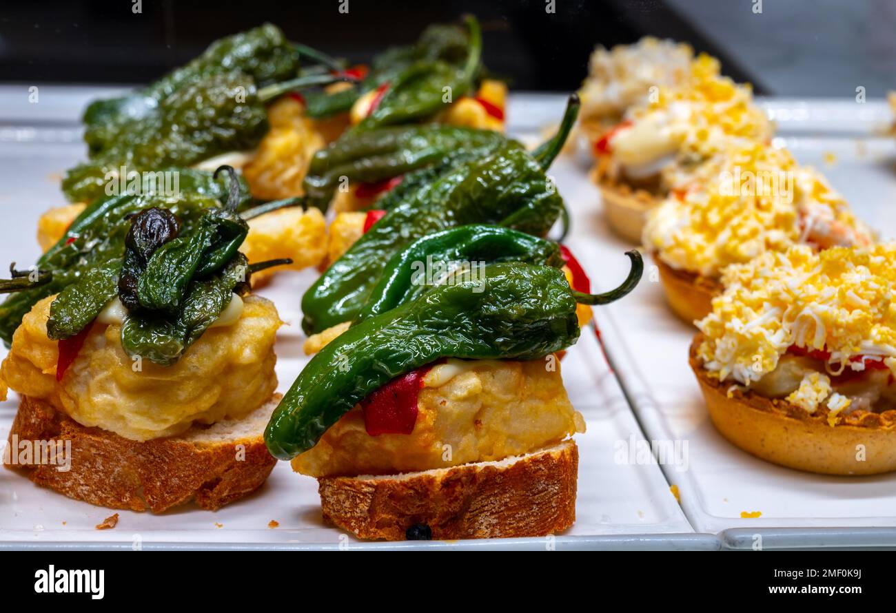 Typical snack of Basque Country, pinchos or pinxtos, small piece of ...