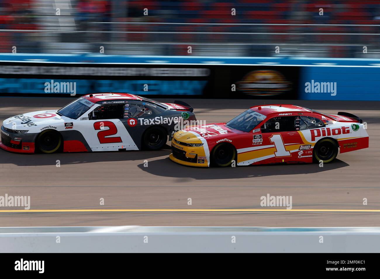 Myatt Snider (2) and Michael Annett (1) race through Turn 4 during a ...