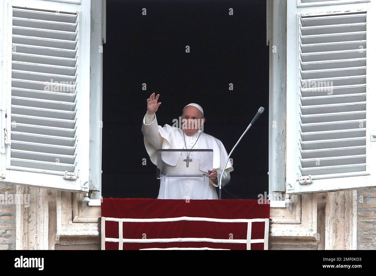 Pope Francis blesses the crowd as he recites the Angelus noon prayer ...