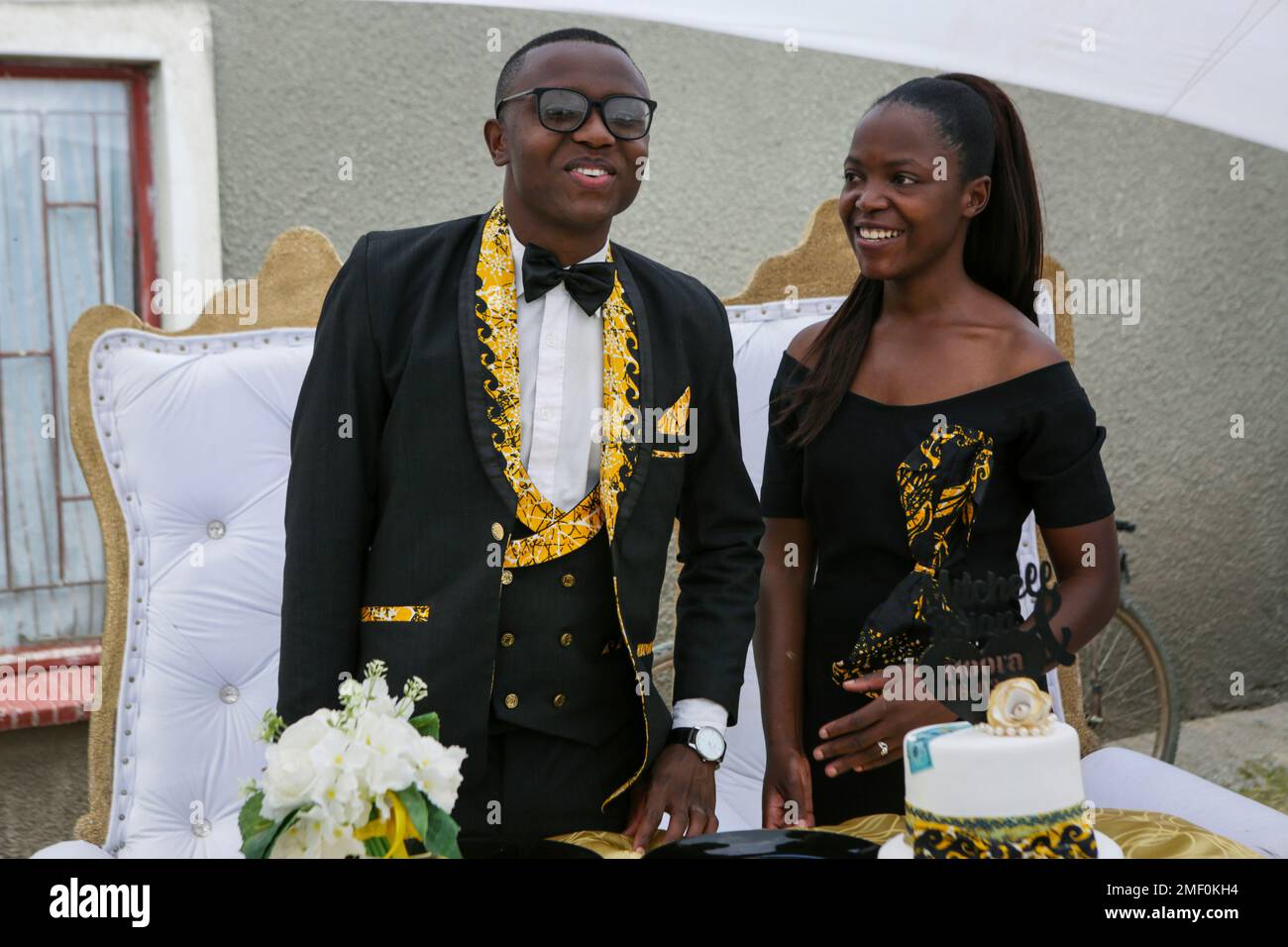 Brian Ngona, left, and Mitchelle Musaraure, pose for a photo after ...